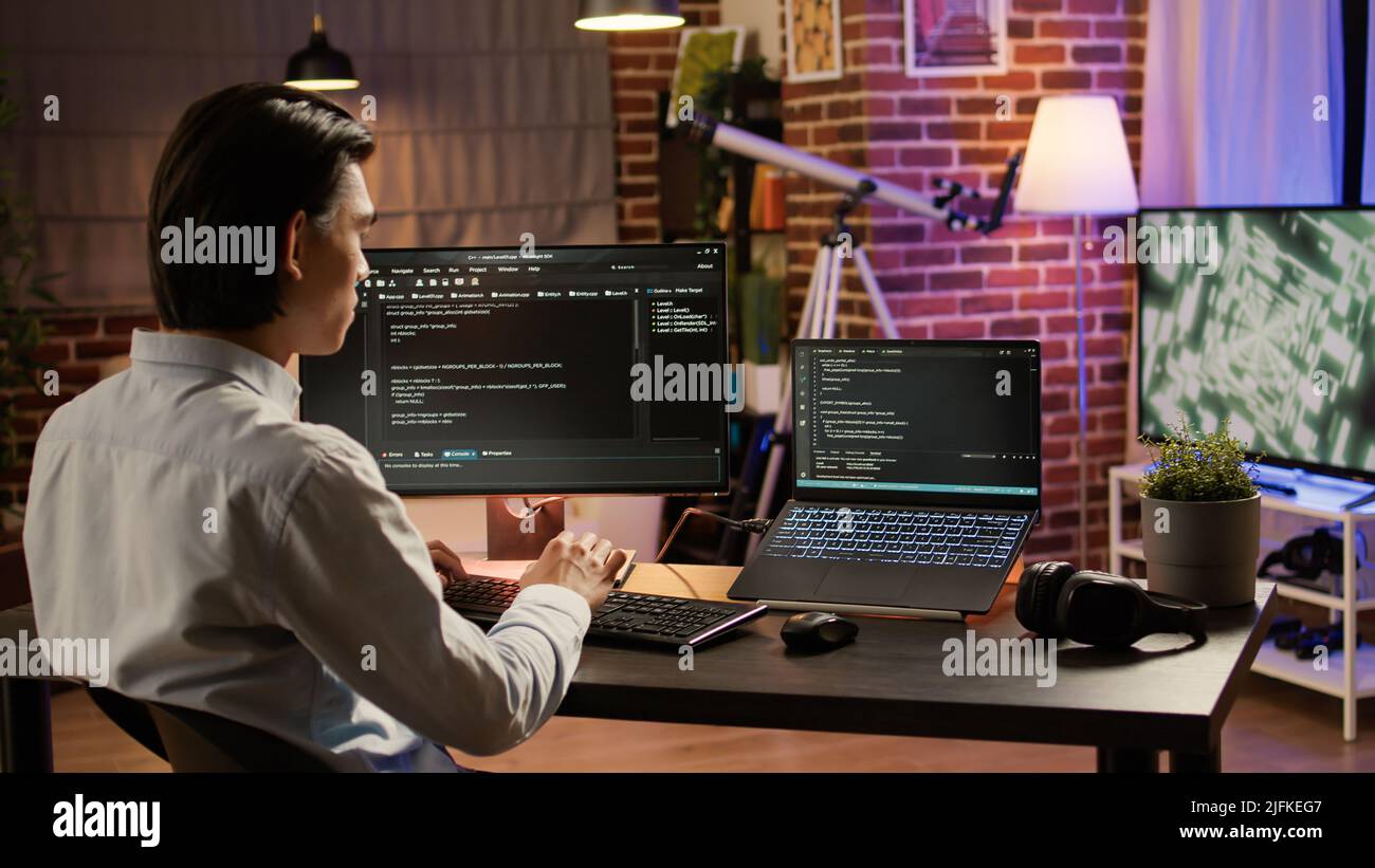 Asian Developer Programming Code On Firewall Server Using Computer And Binary Code To Program 