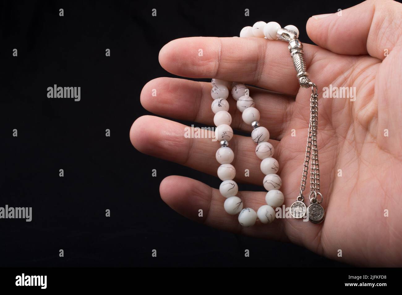 Set of some praying beads of various colors in hand Stock Photo - Alamy