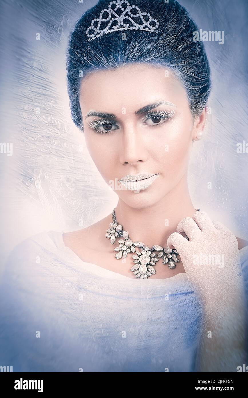 Beautiful snow queen portrait concept on frozen background Stock Photo ...