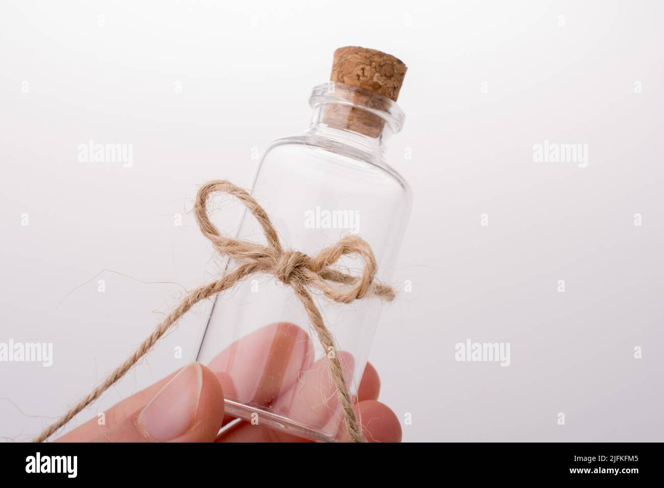 Empty water bottle hand hi-res stock photography and images - Alamy