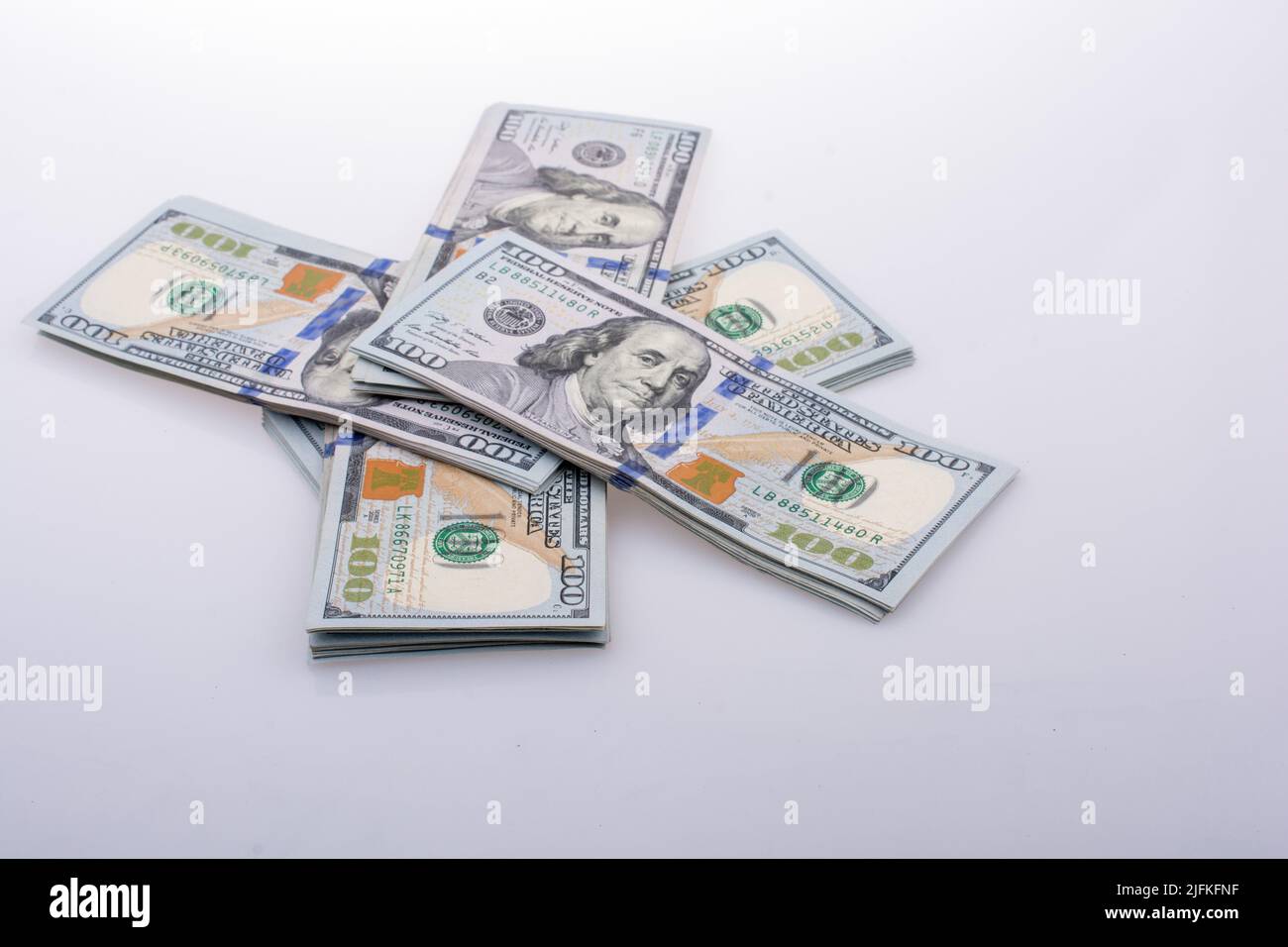American 100 dollar banknote bundles placed on white background Stock ...