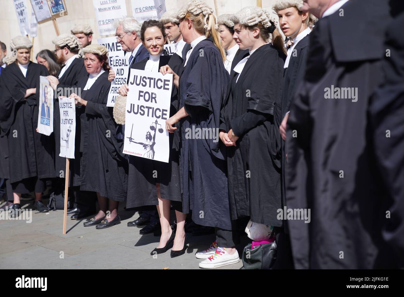 Criminal defence barristers gather outside the Royal Courts of Justice ...