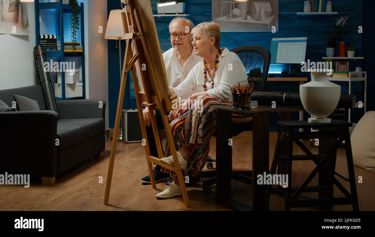 Retired people with artistic skills drawing authentic vase design for art and craft hobby ...