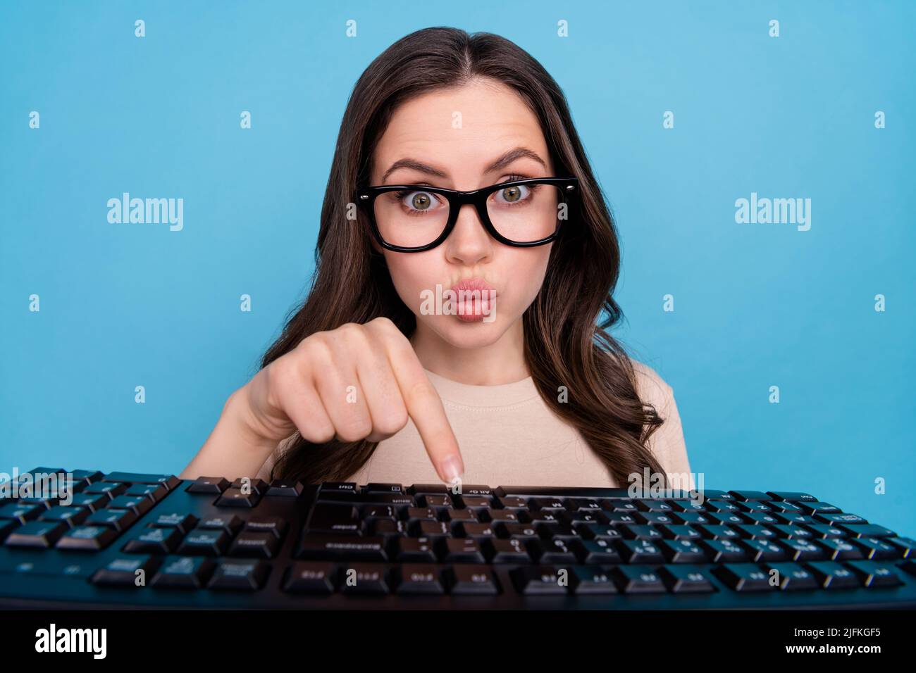 Portrait of amazed lady programmer using technology searching website ...