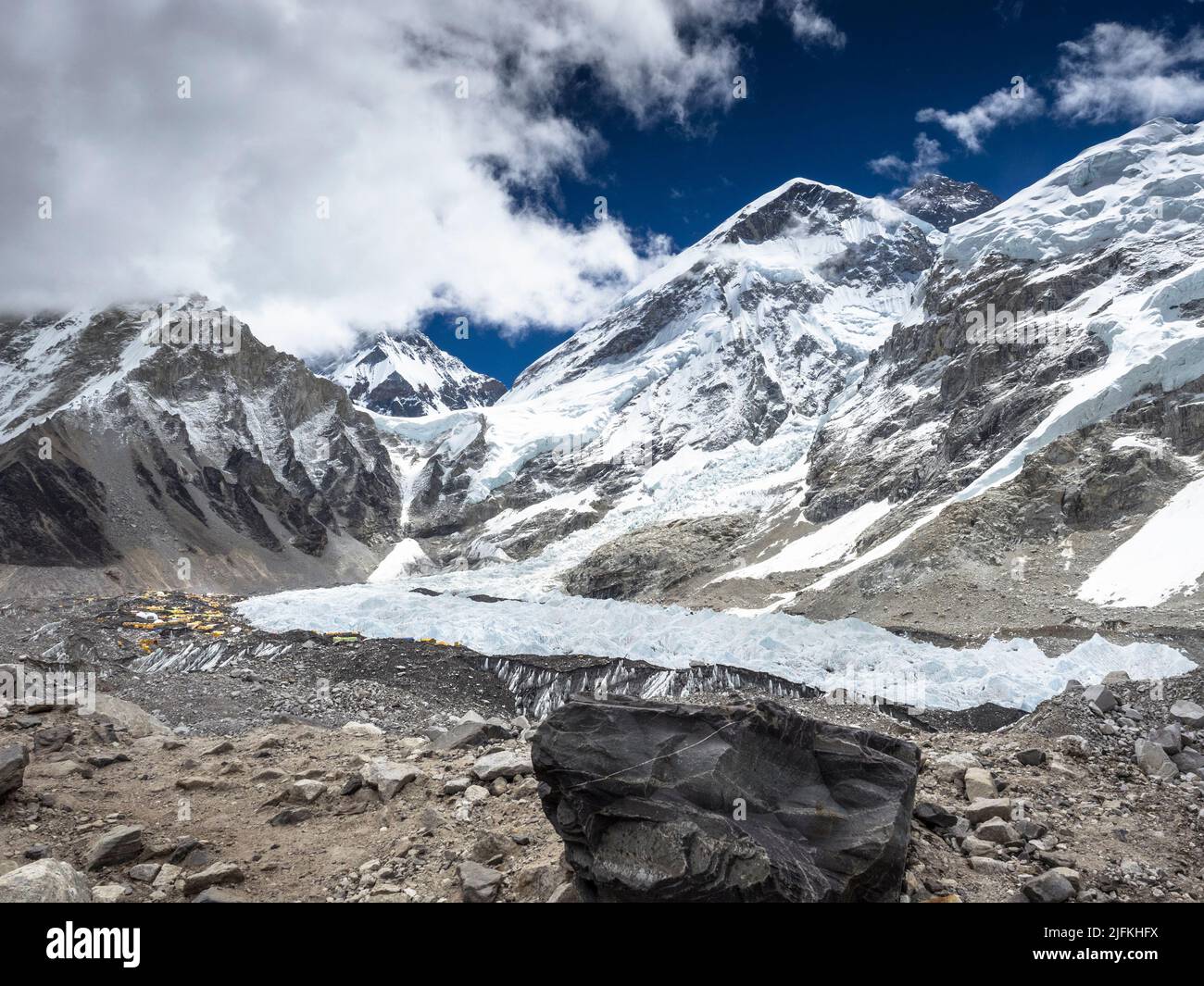 The yellow tents of Everest Base Camp cluster by the edge of the Khumbu ...