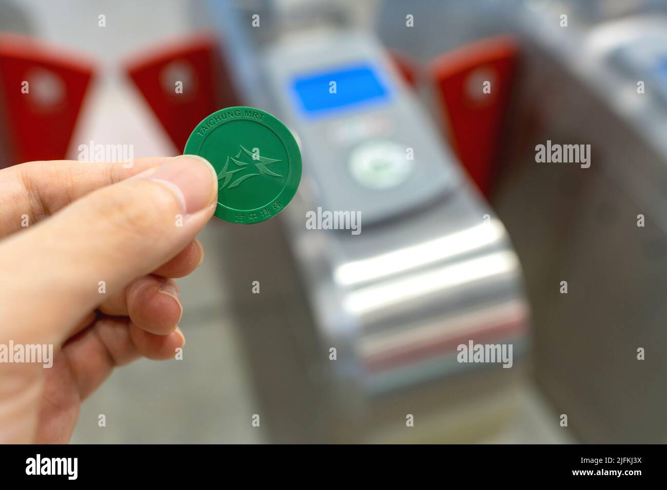 Taichung City, Taiwan - July 3, 2022 : Using one way ticket coin token ...