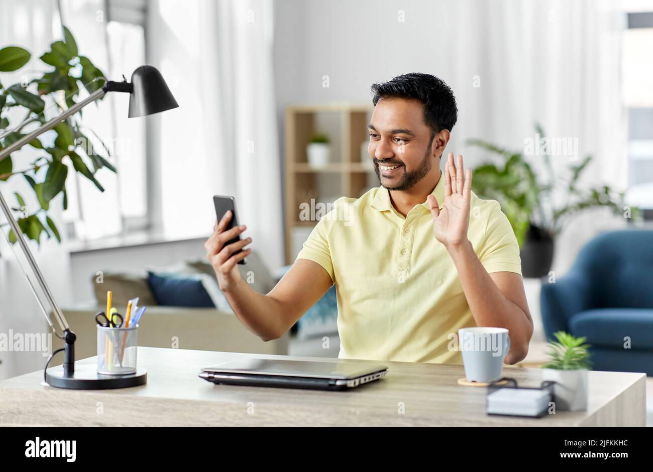 indian man having video call on smartphone at home Stock Photo - Alamy