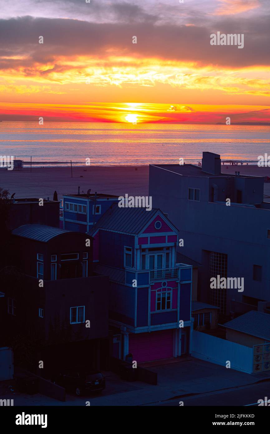 An aerial vertical view of an amazing sunset over the sea with ...