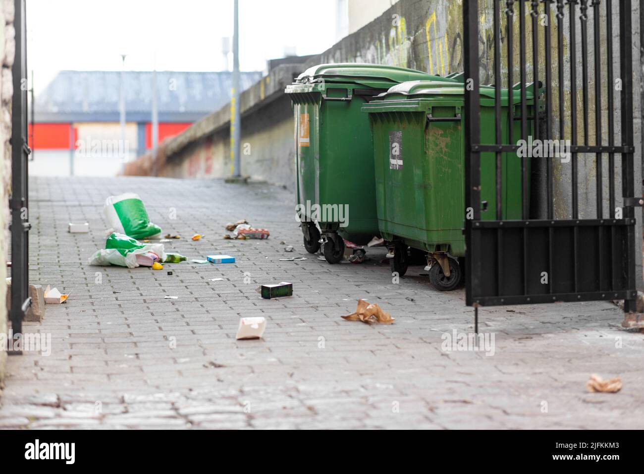 dumpsters on messy city street or courtyard Stock Photo - Alamy