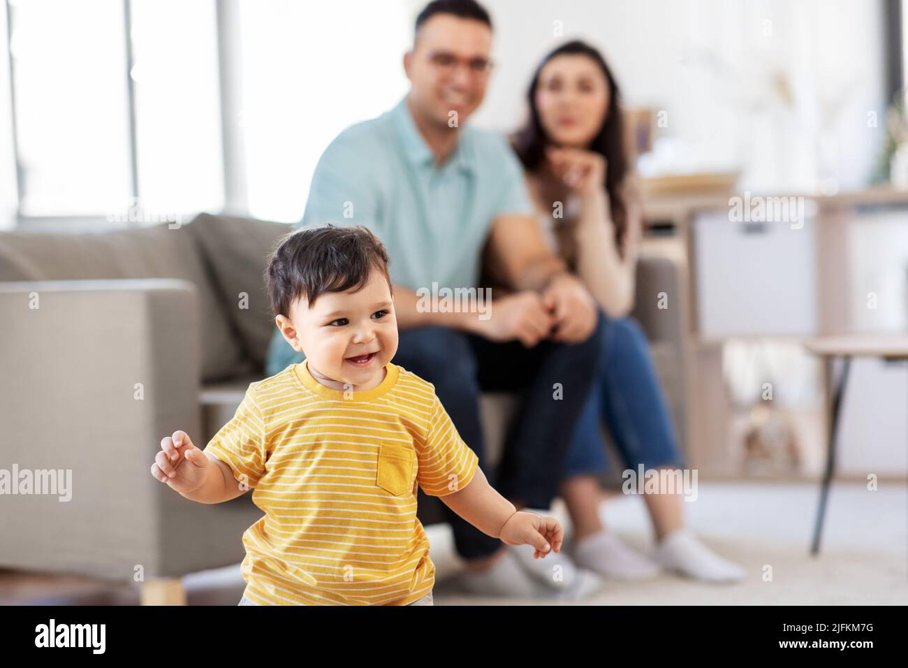 happy baby boy and parents at home Stock Photo - Alamy