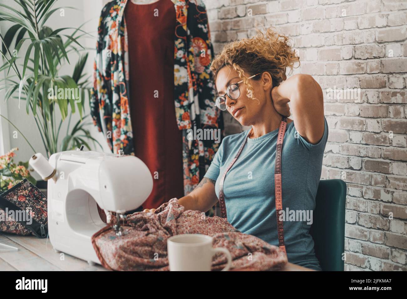 Woman female sewing hi-res stock photography and images - Alamy