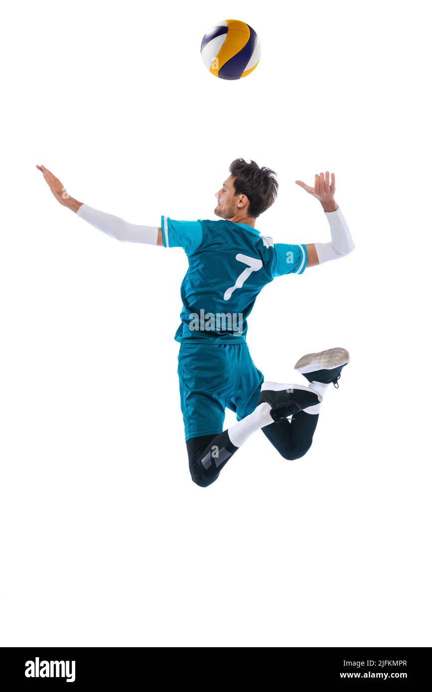 Portrait of young man, volleyball player in motion, training, playing ...