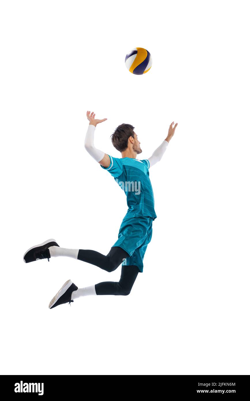 Portrait of young man, volleyball player in motion, training, playing ...