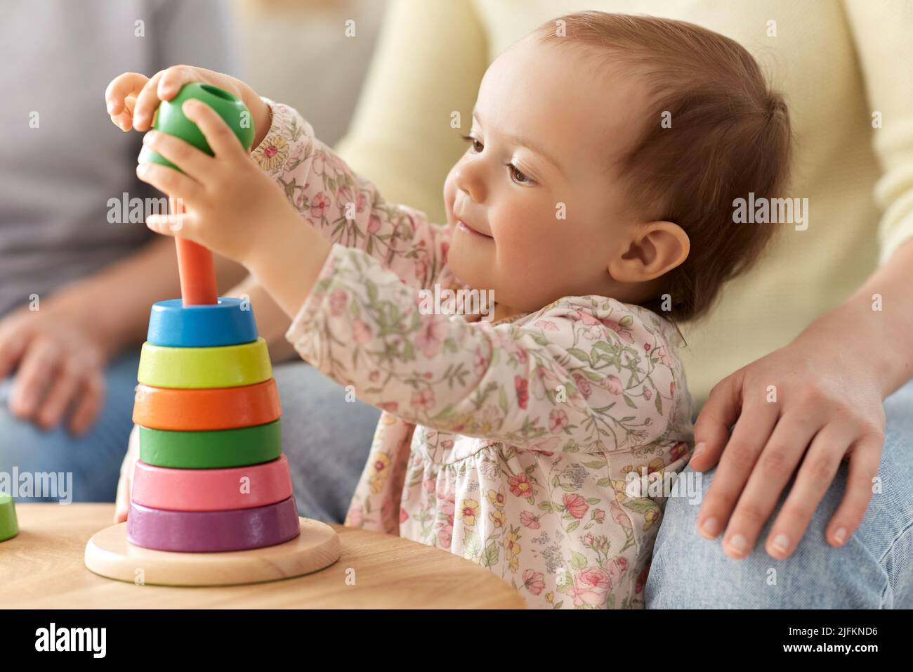 happy baby girl playing with toy pyramid at home Stock Photo - Alamy
