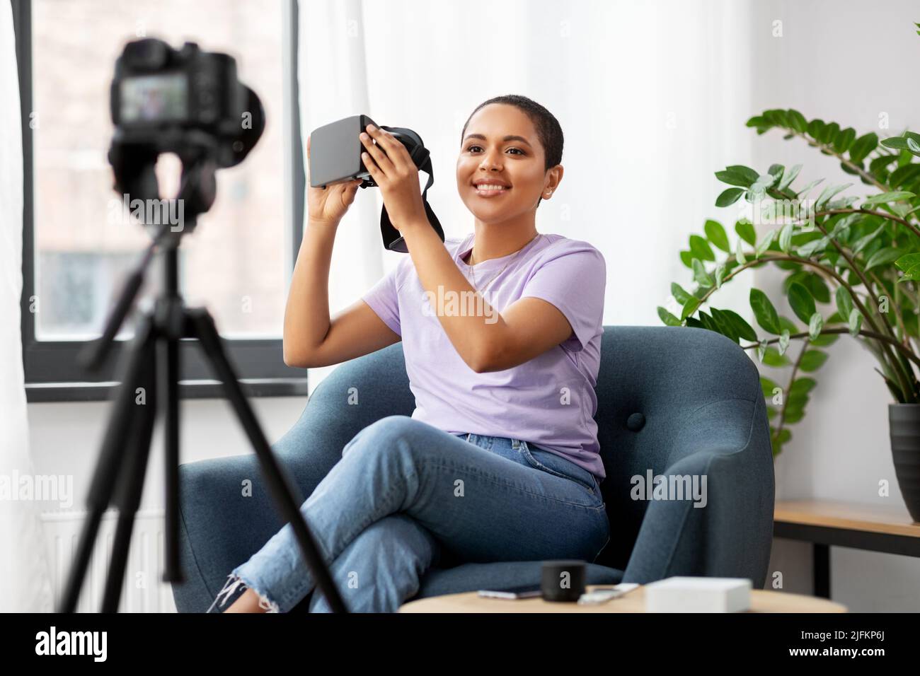 female blogger with camera and vr glasses at home Stock Photo - Alamy