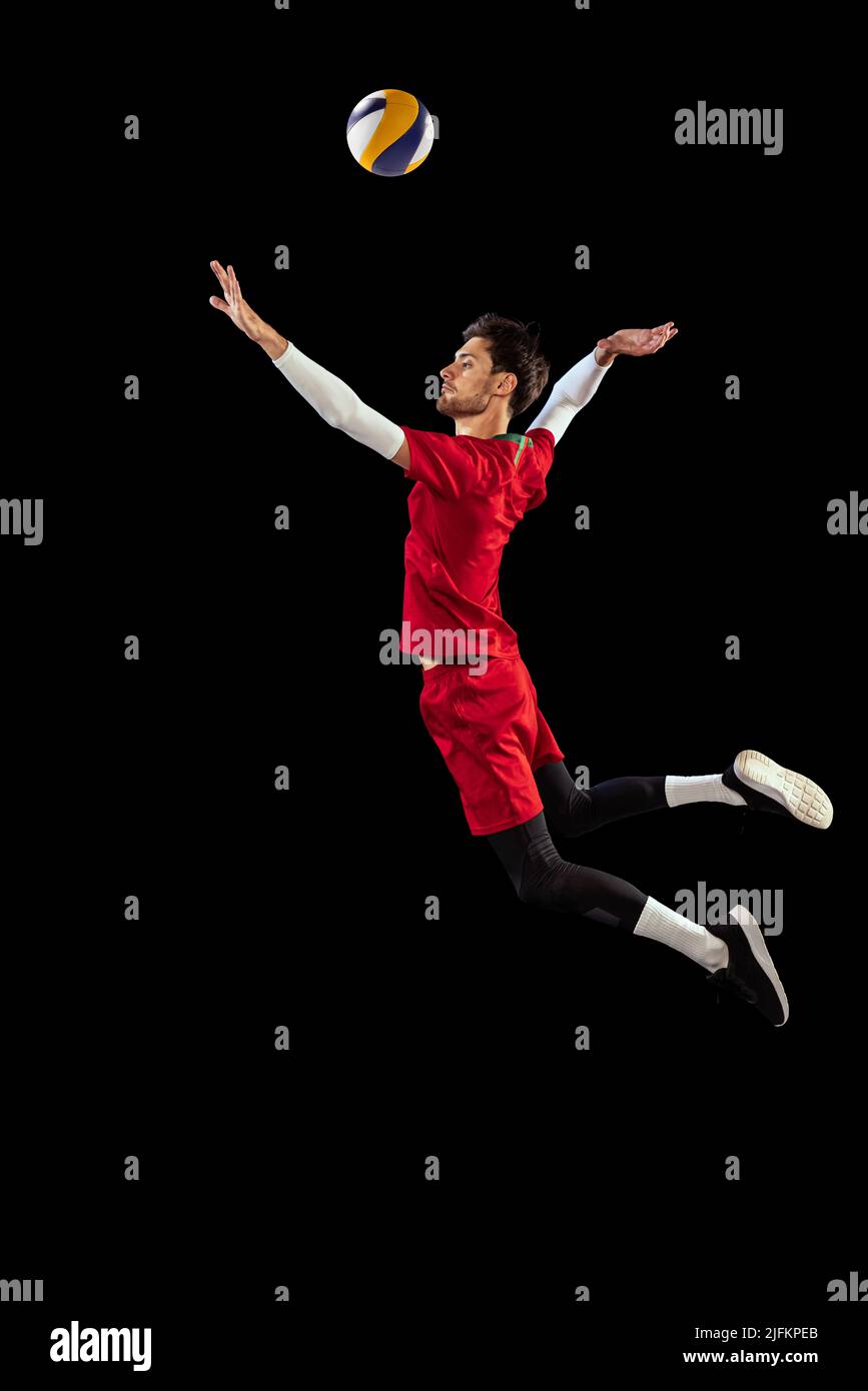 Portrait of young man, volleyball player in motion, training, playing ...