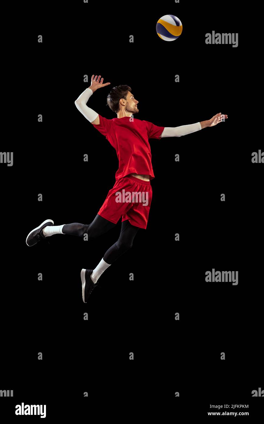 Portrait of young man, volleyball player in motion, training, playing ...