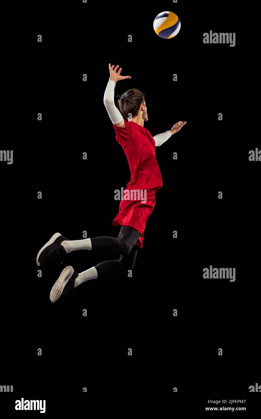 Portrait of young man, volleyball player in motion, training, playing ...