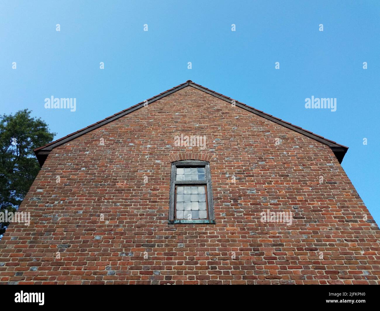 red brick or masonry building or structure with window and sky Stock ...