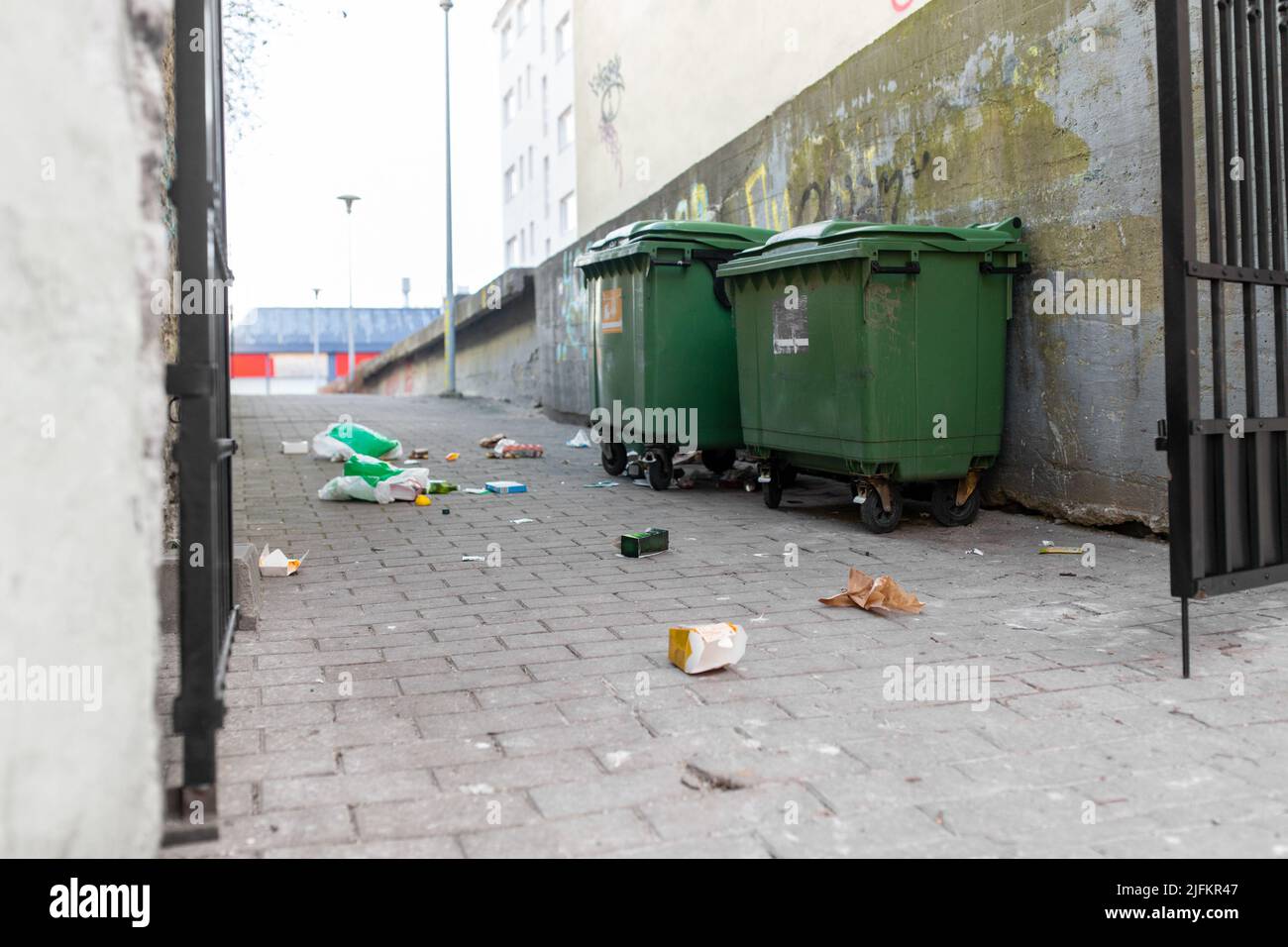 dumpsters on messy city street or courtyard Stock Photo - Alamy