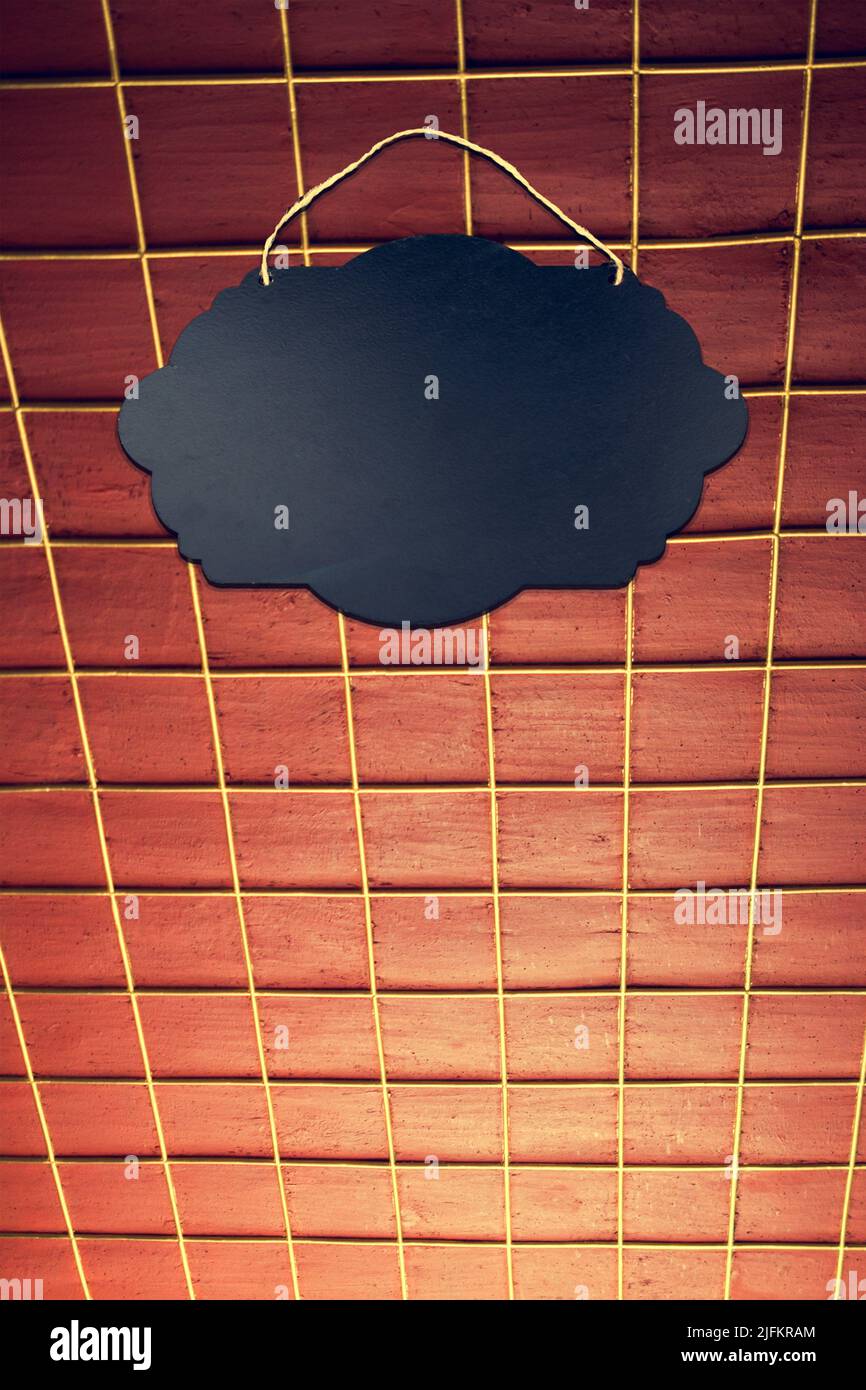 Black Empty Sign Board with string for hanging on wall Stock Photo - Alamy