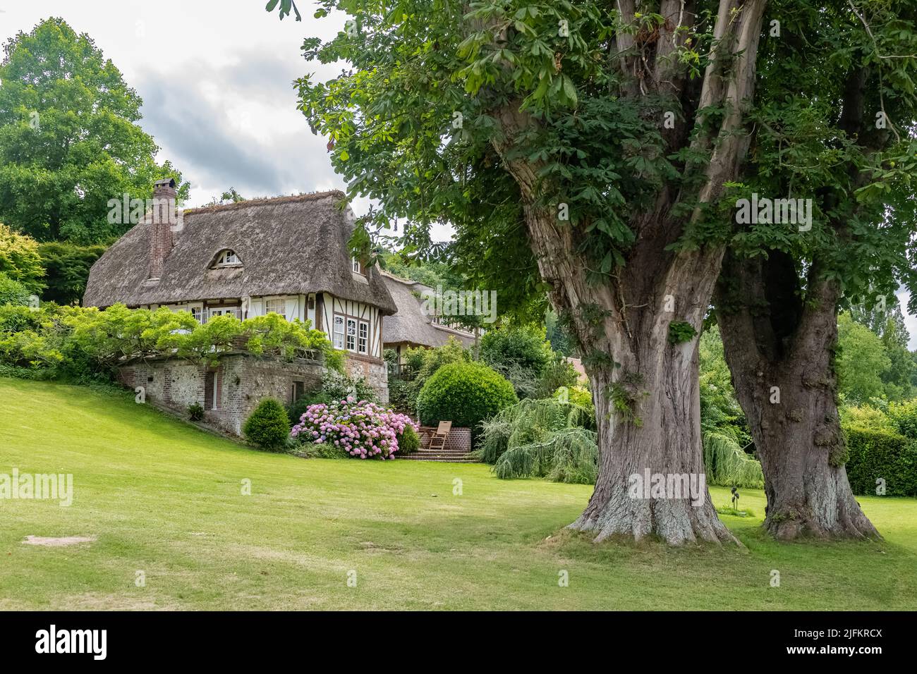 A thatched cottage in Normandy, on the banks of the Seine, beautiful ...
