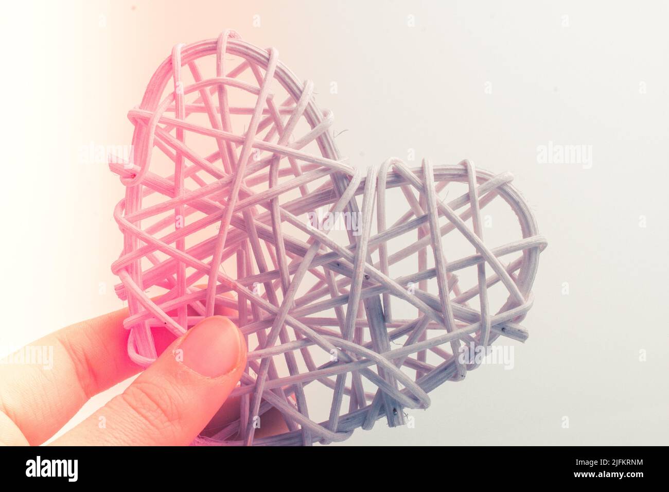 Handmade straw heart or valentines day object in hand Stock Photo - Alamy