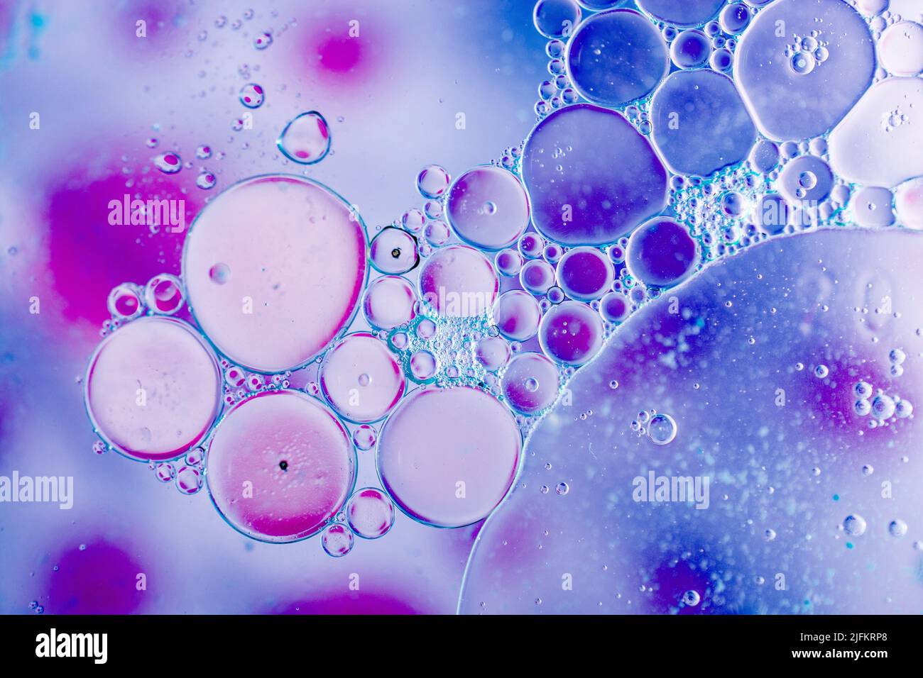 Oil bubbles inside water base form patterns Stock Photo - Alamy
