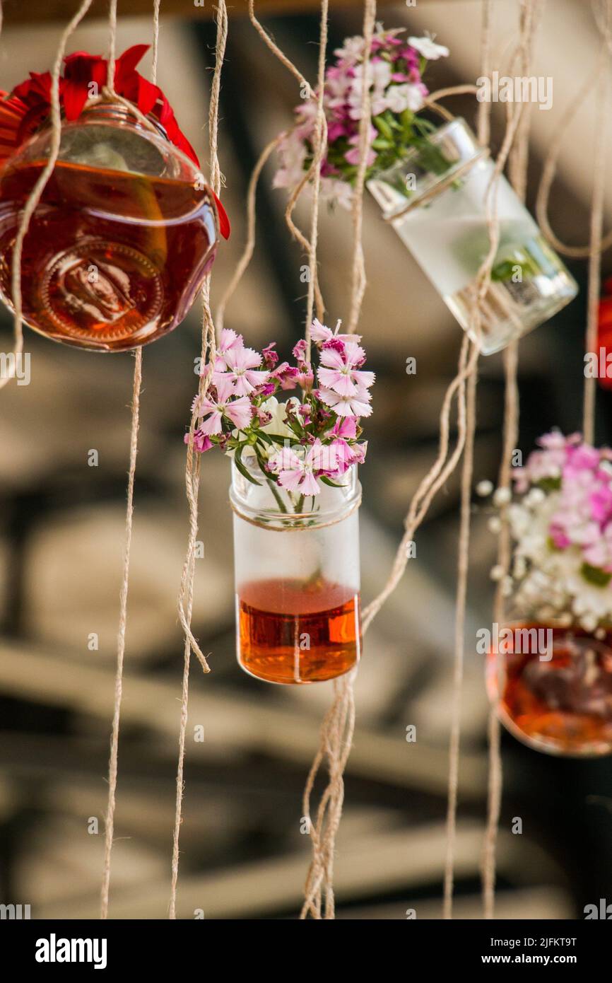 Hanging strings of flowers hi-res stock photography and images - Alamy