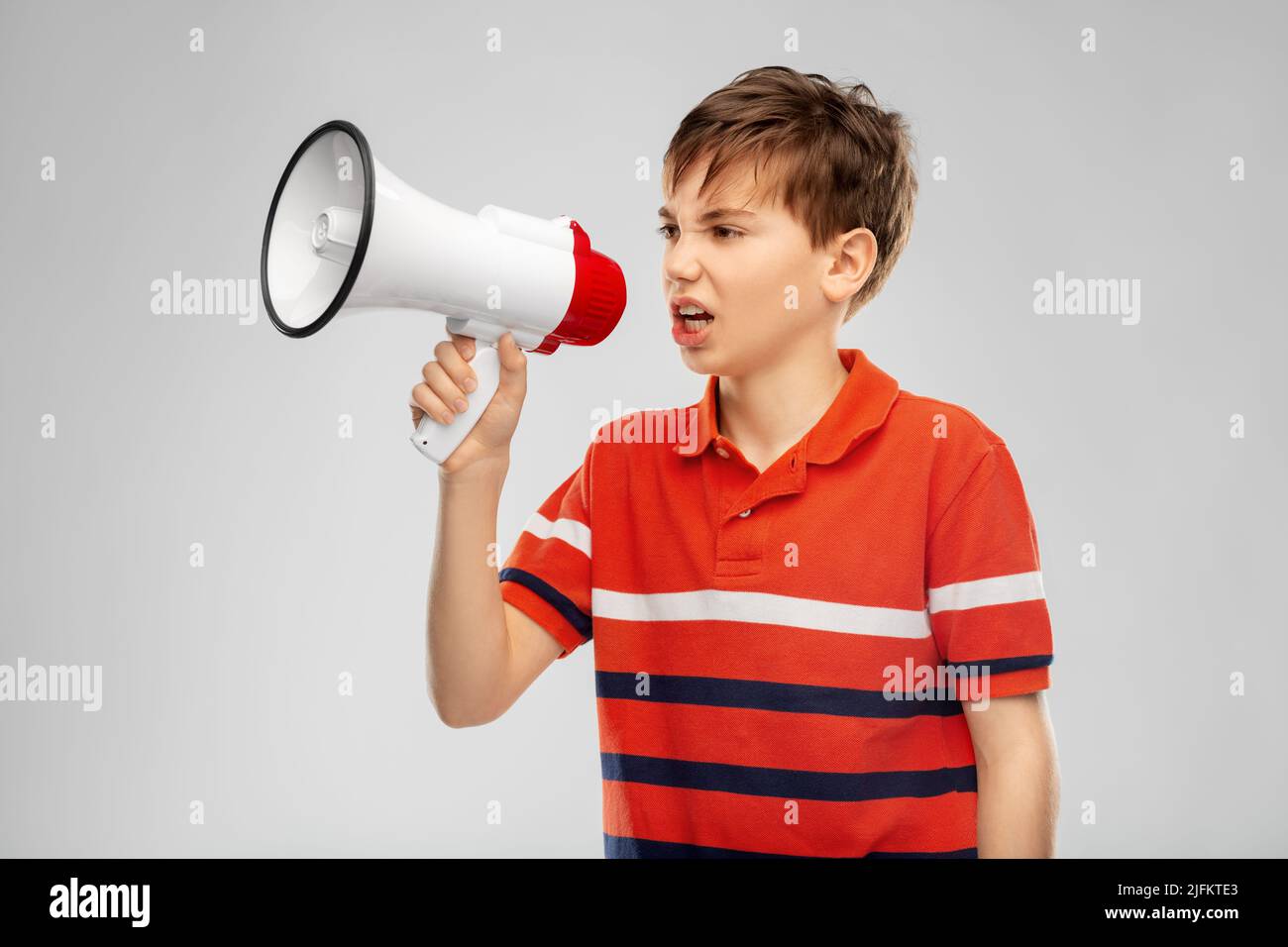 angry boy speaking to megaphone Stock Photo - Alamy