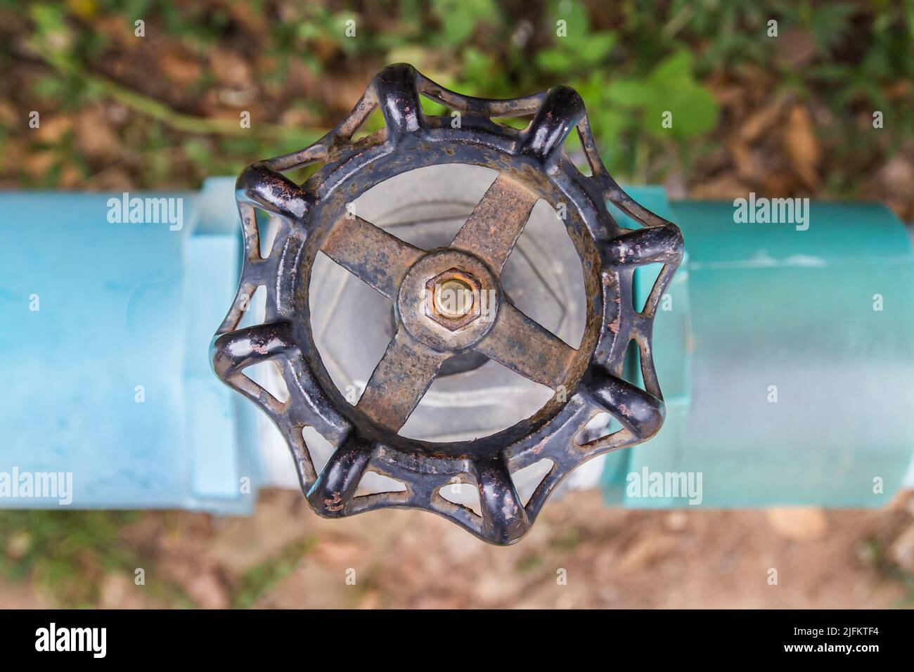 Closeup old water valve and blue pipe Stock Photo - Alamy