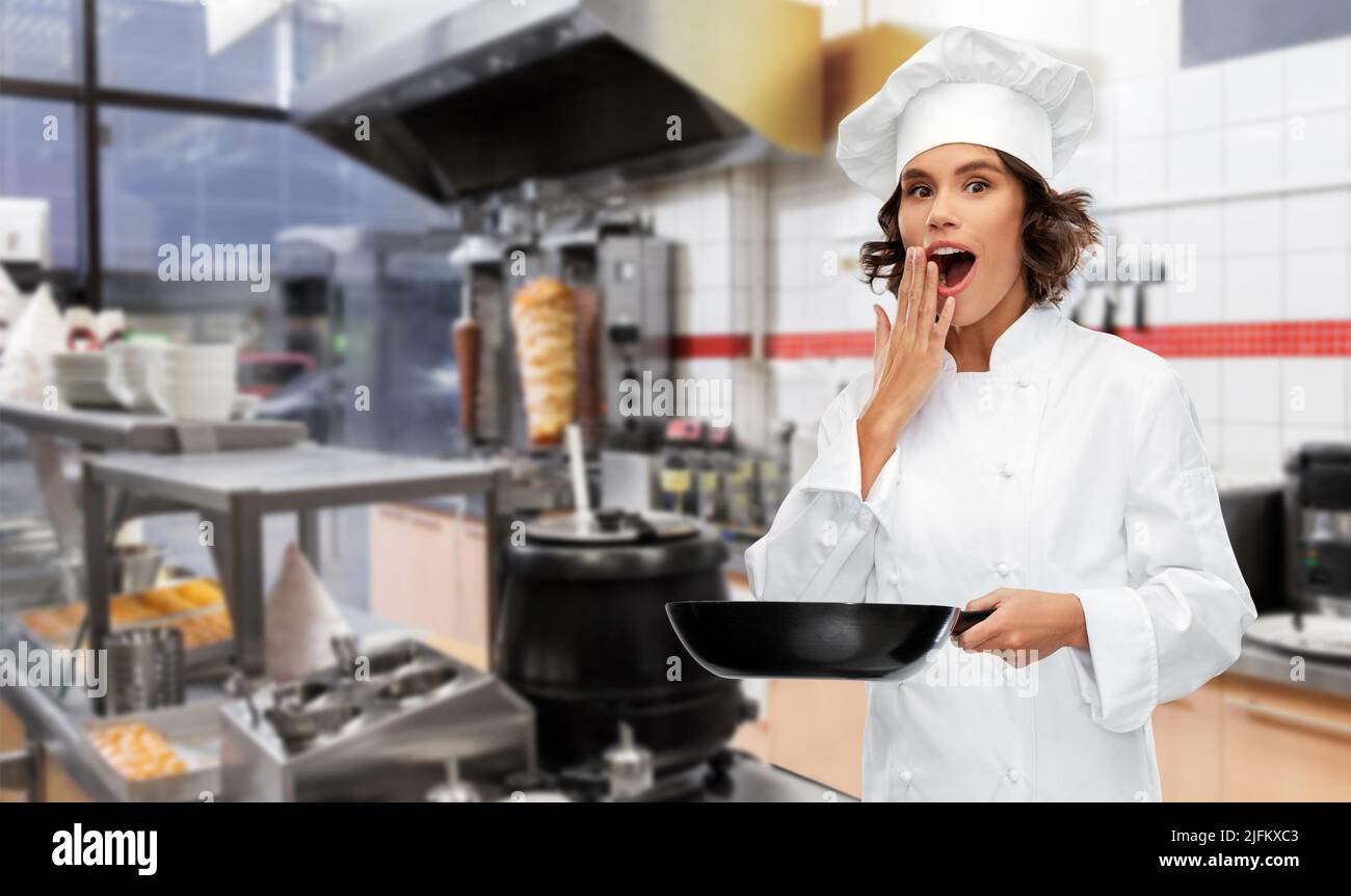 surprised chef with frying pan at kebab shop Stock Photo - Alamy