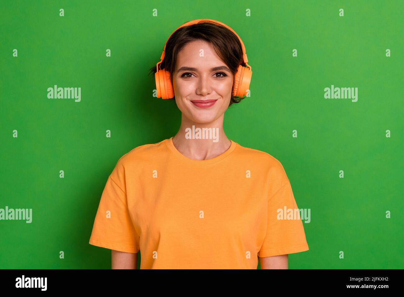 Photo of funky cheerful young lady wear orange outfit headphones ...