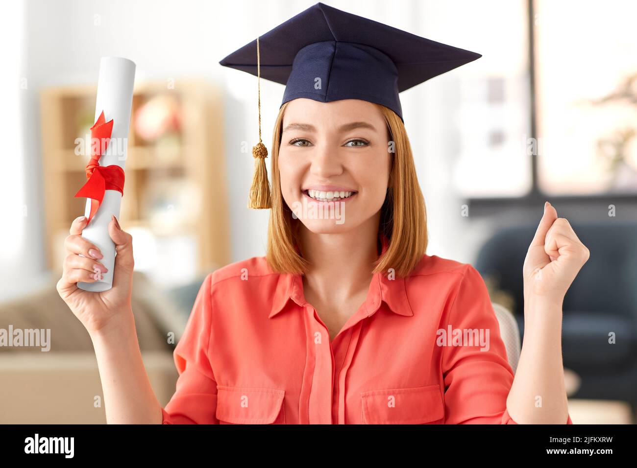 Happy graduate student diploma sitting hi-res stock photography and ...