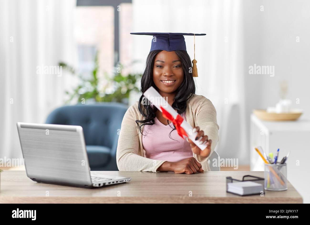 Happy graduate student diploma sitting hi-res stock photography and ...