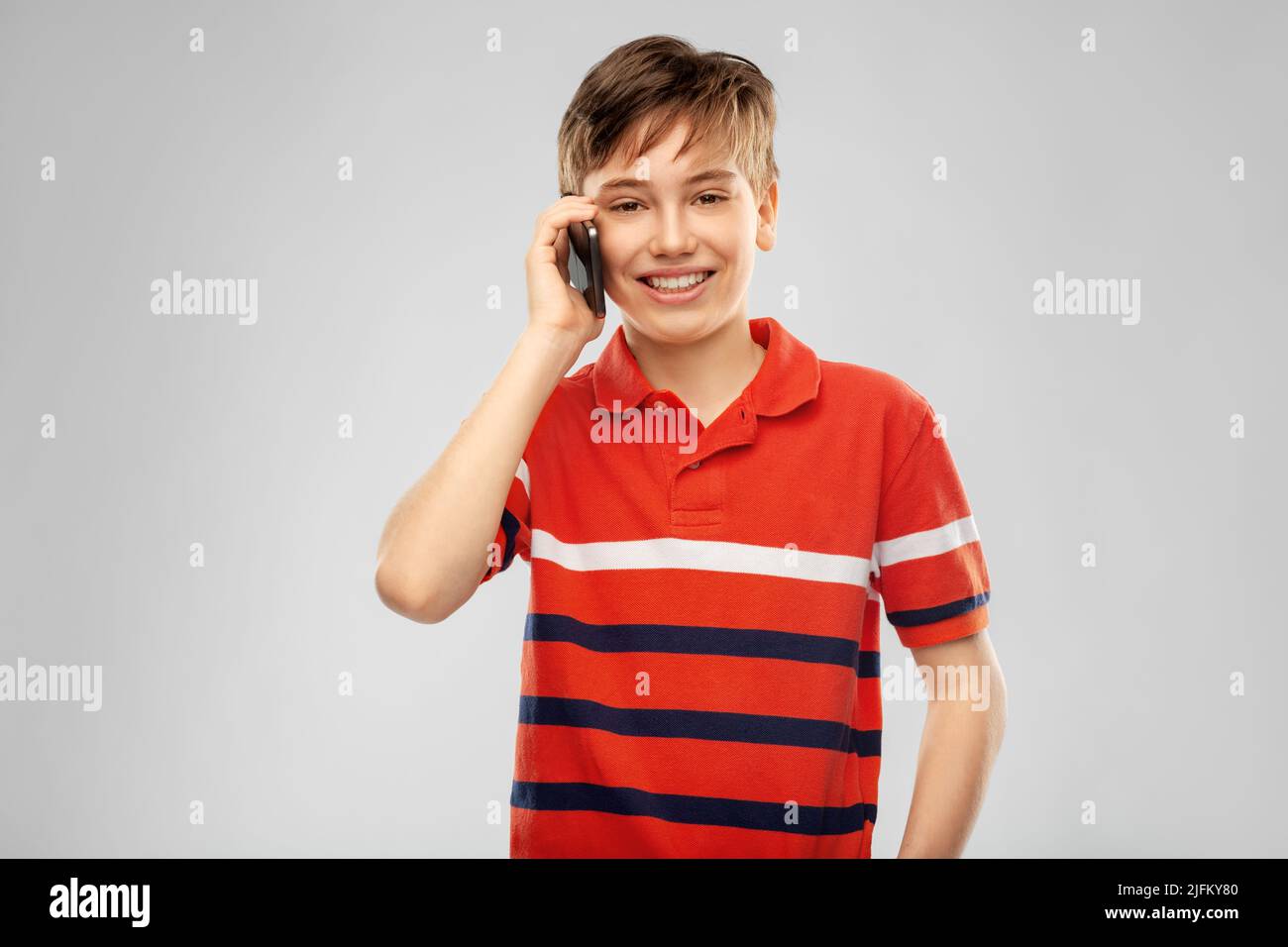 happy smiling boy calling on smartphone Stock Photo - Alamy