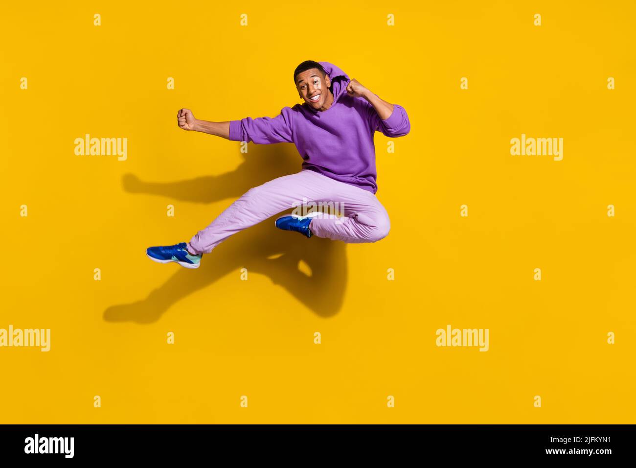 Full length body size view of handsome trendy strong guy jumping ...