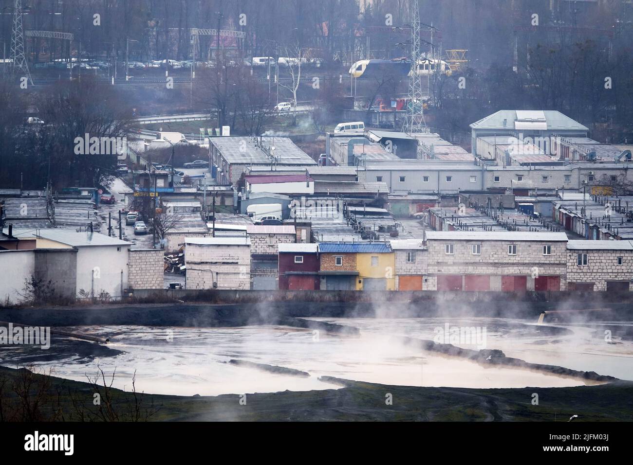 Kiev, Ukraine December 26, 2019: Pipes pour production waste, polluting ...