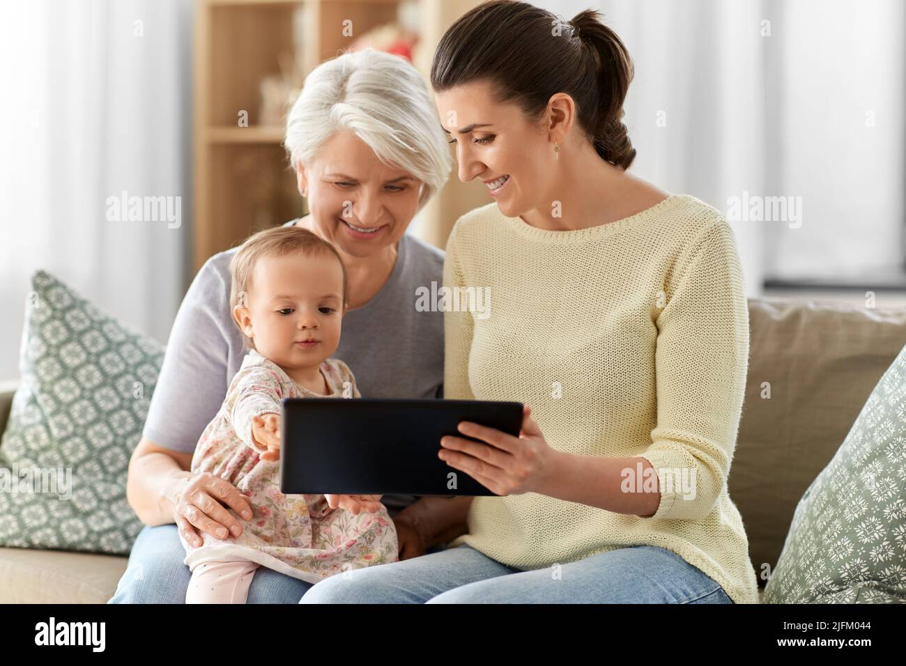 mother, daughter and grandma with tablet pc Stock Photo - Alamy
