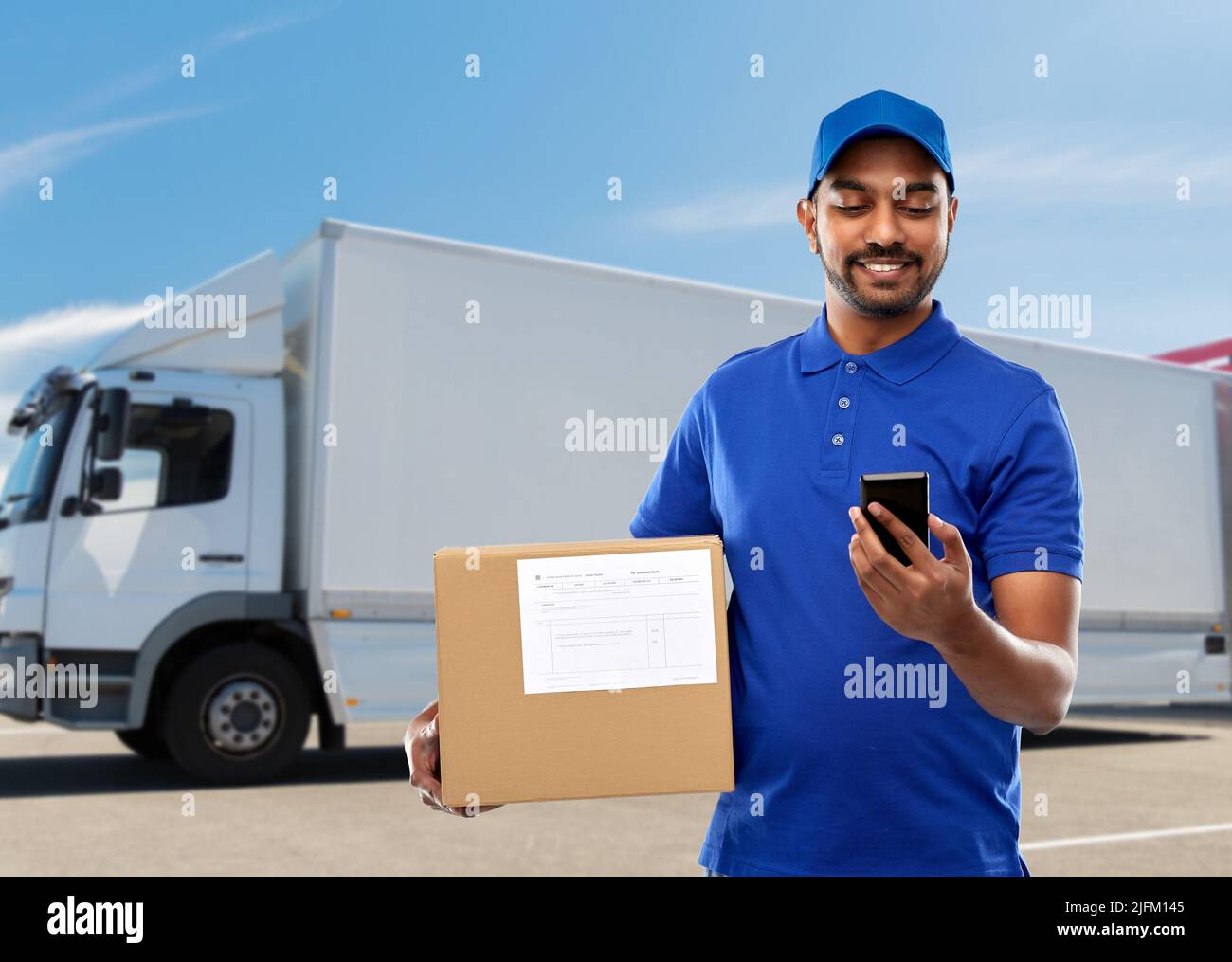 indian delivery man with smartphone and parcel box Stock Photo - Alamy