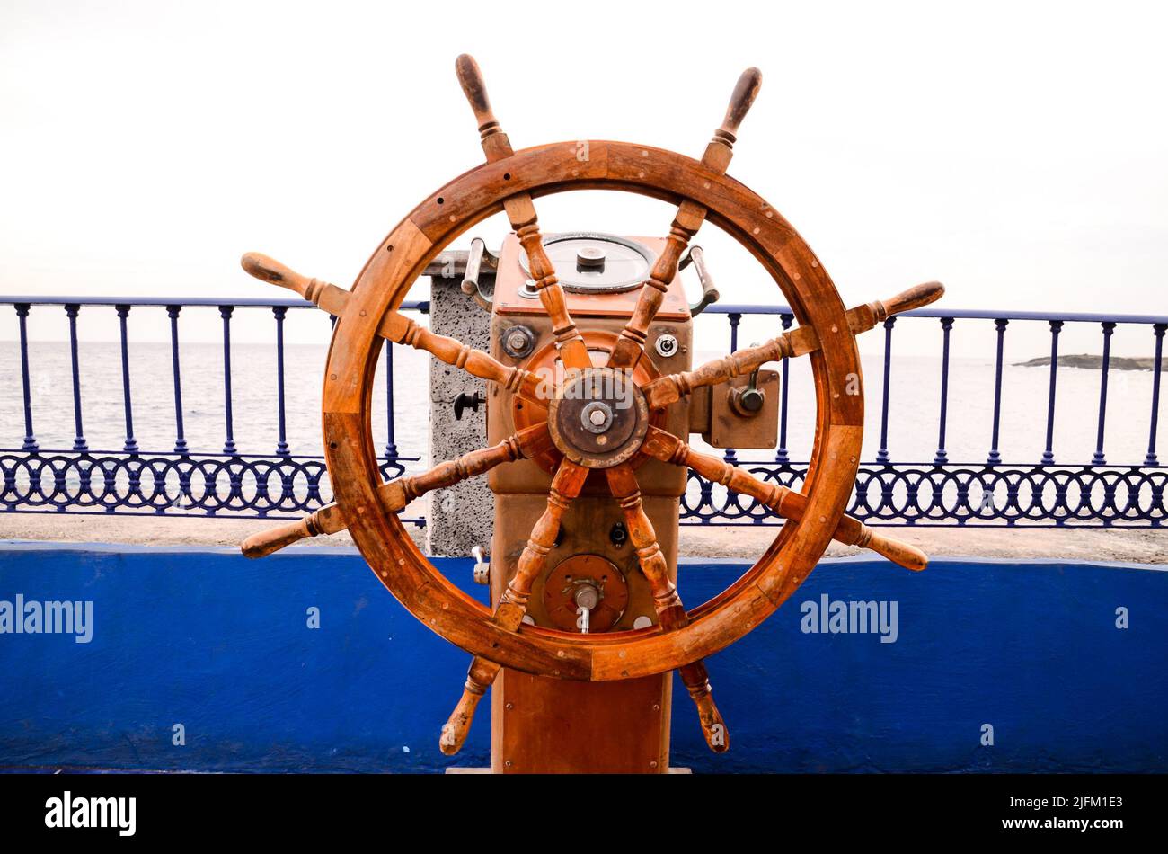 Old Vintage Wooden Helm Wheel near Blue Ovcean Stock Photo - Alamy