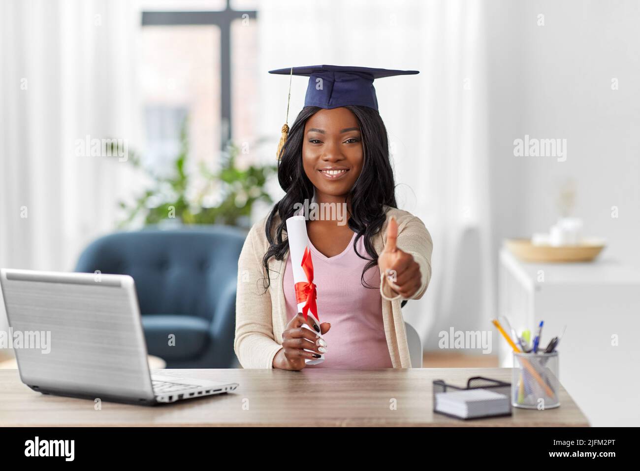 Happy graduate student diploma sitting hi-res stock photography and ...