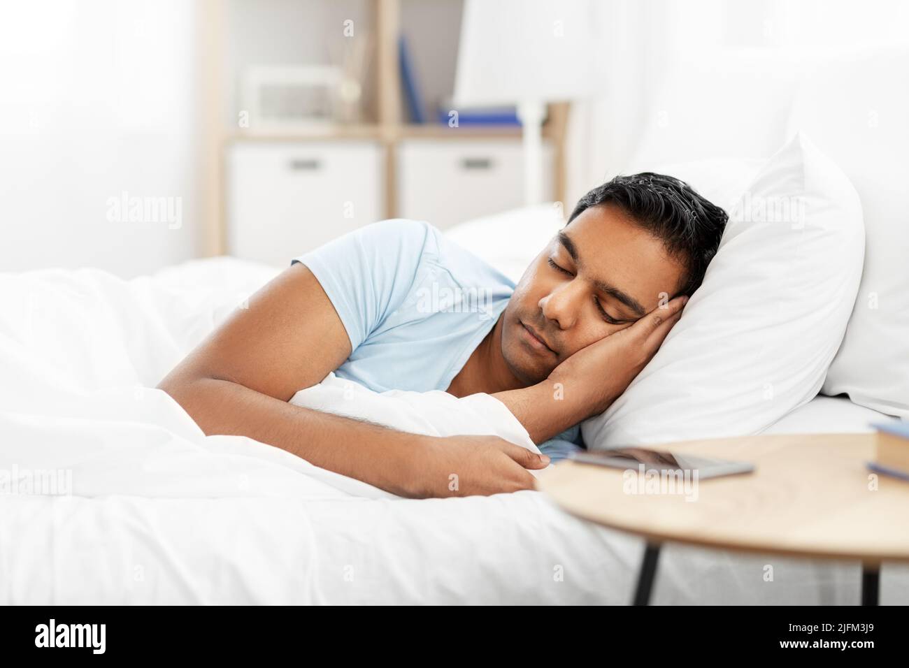indian man sleeping in bed at home Stock Photo - Alamy