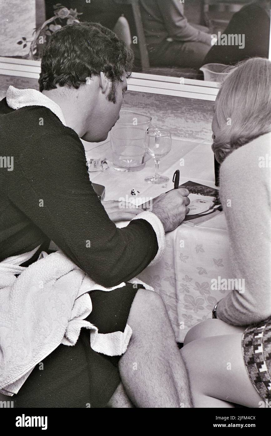 TOM JONES Welsh pop singer signs an autograph while preparing for a ...