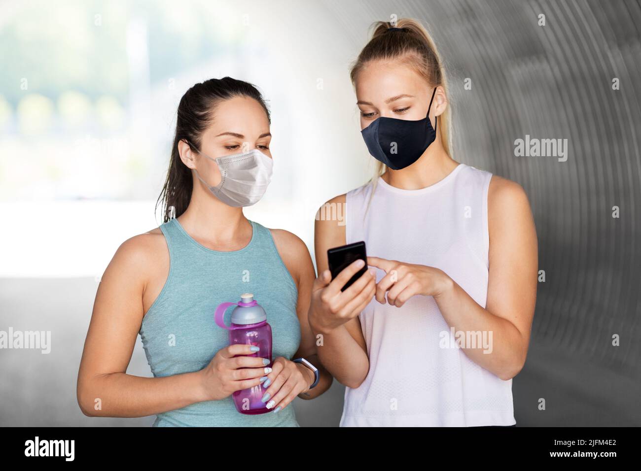 women or female friends with smartphone and flask Stock Photo - Alamy