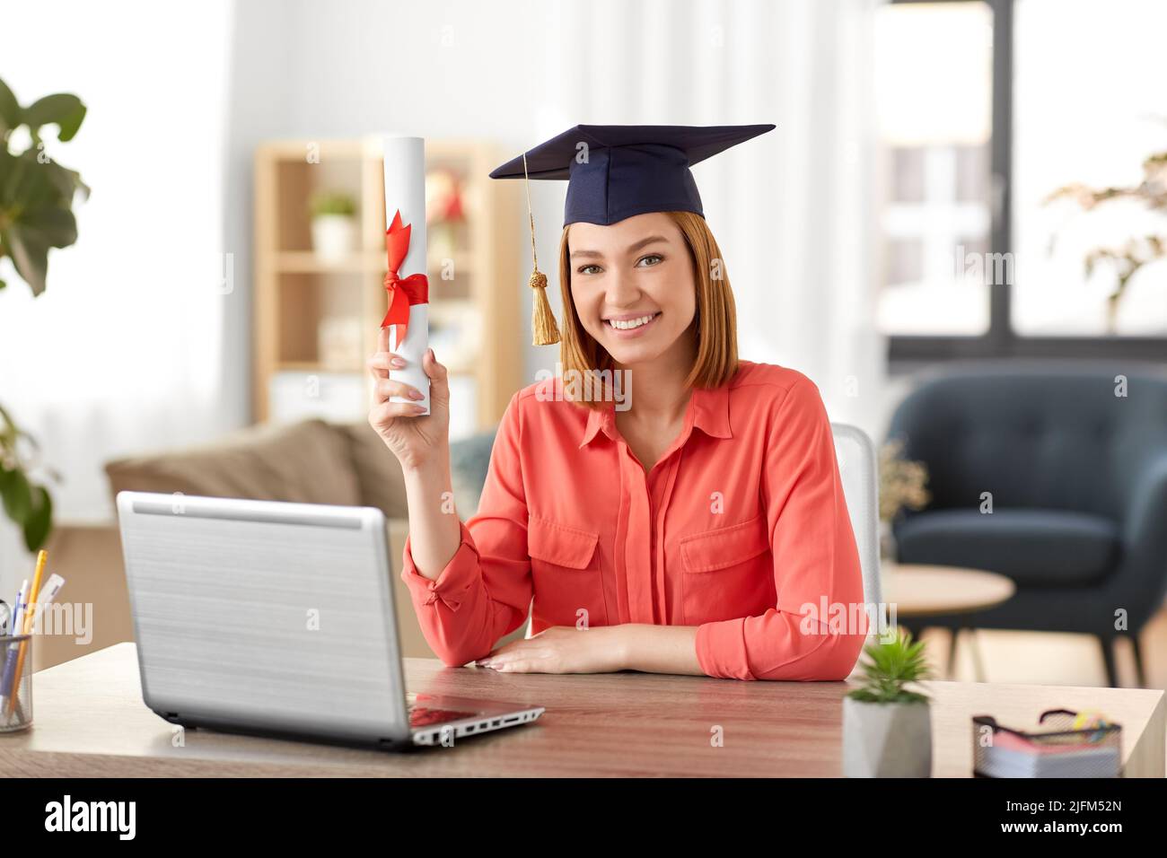Happy graduate student diploma sitting hi-res stock photography and ...
