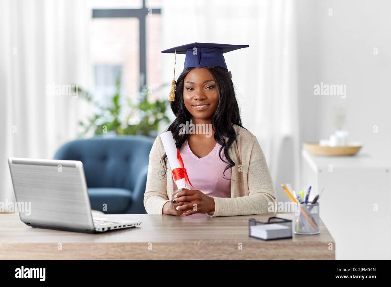 Happy graduate student diploma sitting hi-res stock photography and ...