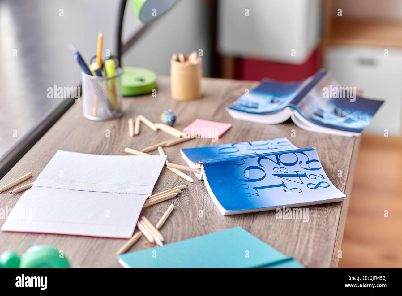 school supplies scattered on table at home Stock Photo - Alamy