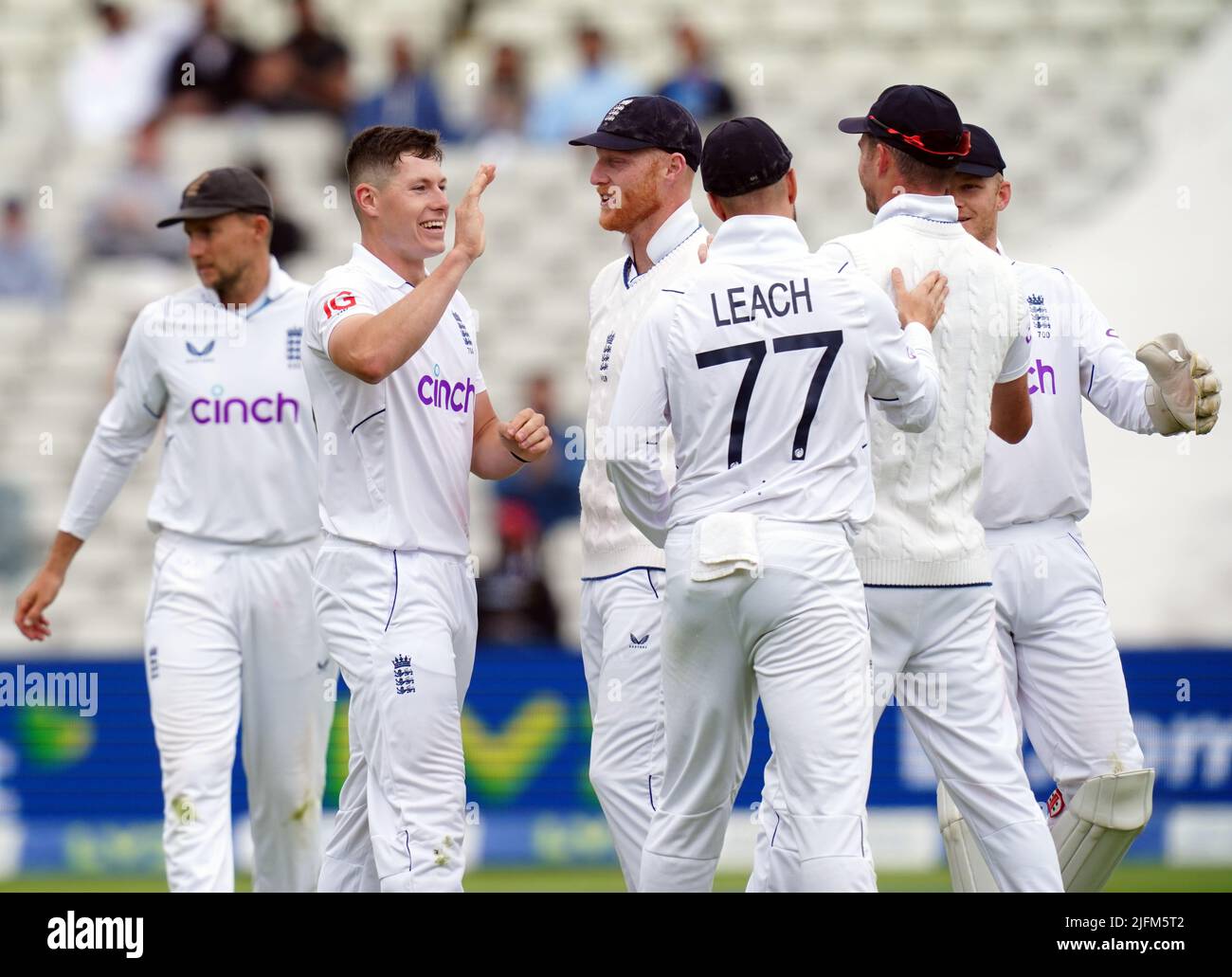 England's Matthew Potts (second left) celebrates the wicket of India's ...