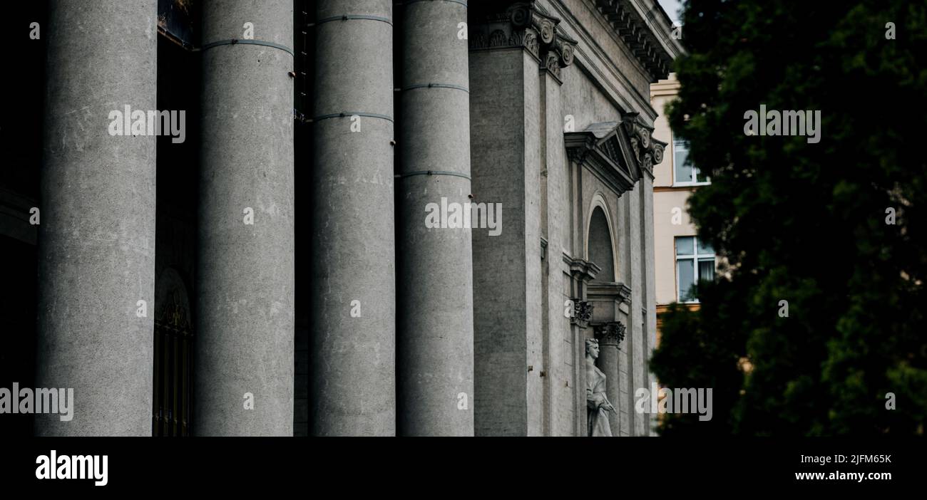 classic columns of old building. grey city background. historical ...